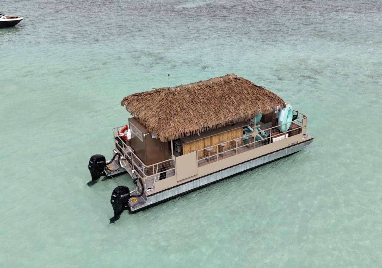 Tiki Party Boat Charter | Curator Hotel & Resort Collection